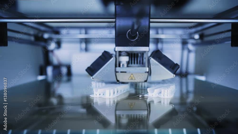 Super close focus on micro 3d printer head at work, printing small ...