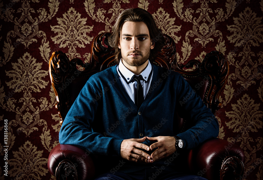 Foto Stock gentleman on a chair | Adobe Stock