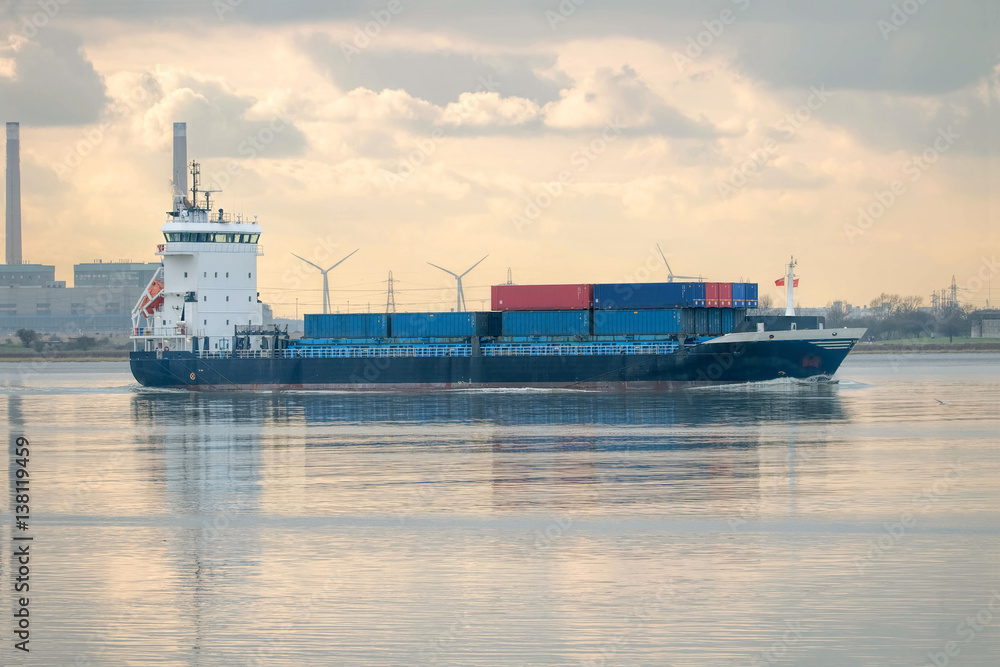 Feeder ship. Cargo container vessel on industrial river. Stock Photo ...