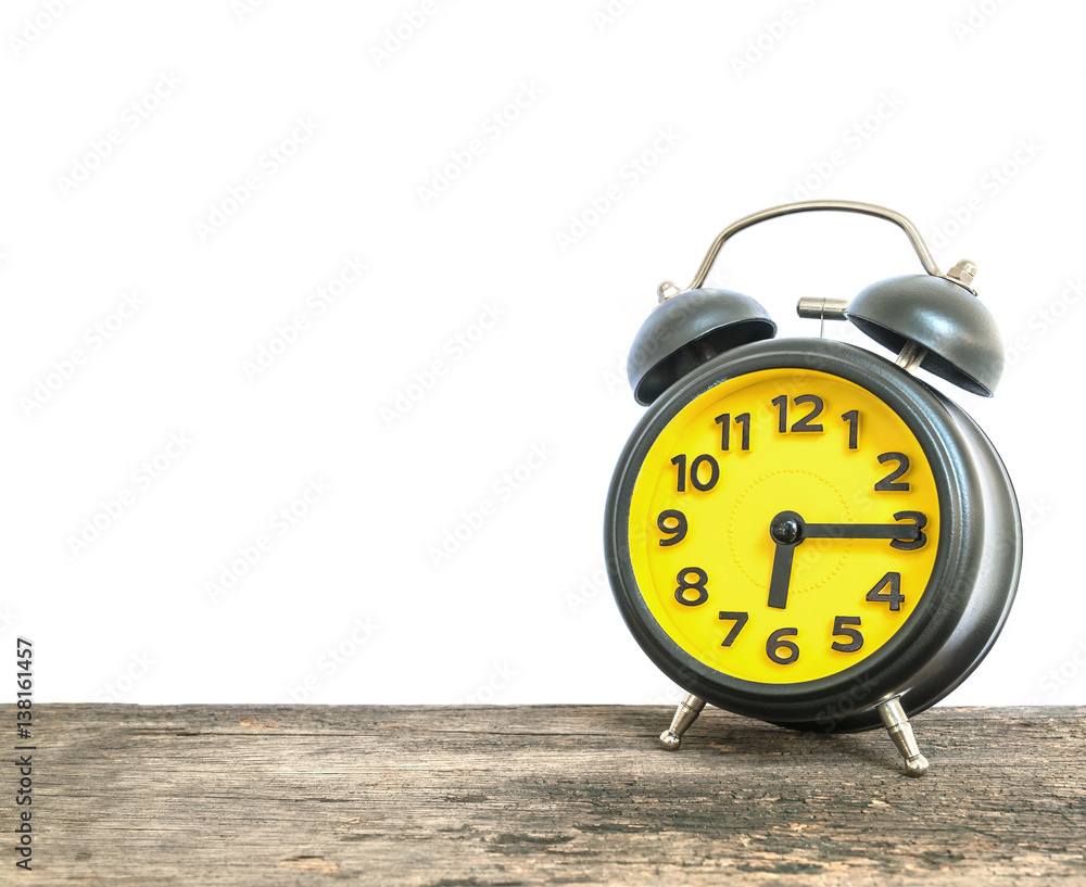 Closeup black and yellow alarm clock for decorate show a quarter past ...