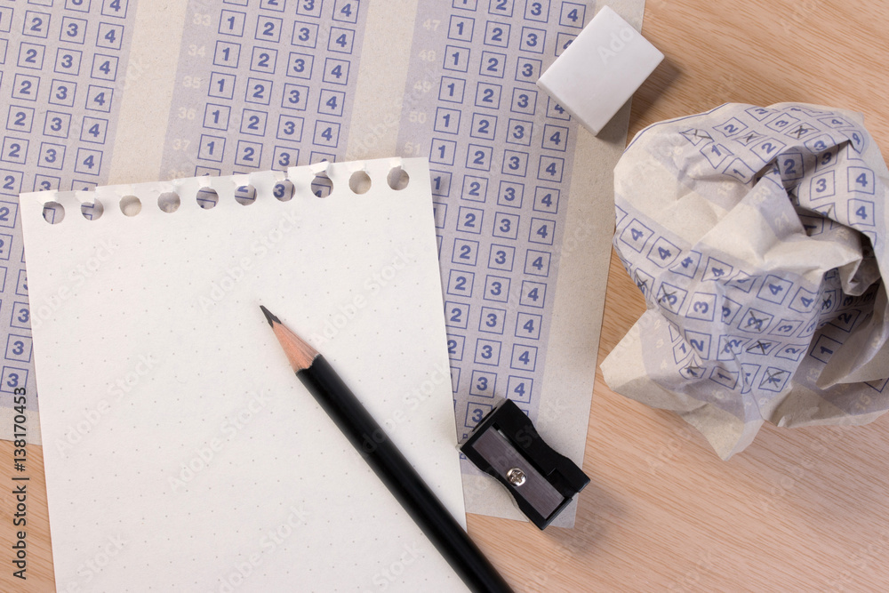 Crumpled paper ball of vintage classic answer sheet with pencil ...