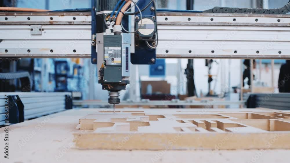 Front view on big drill of industrial wood cut machine programmed to ...