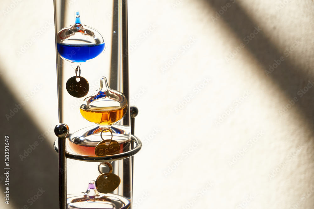 science glass tube with colorful chemical in glass ball in front of ...