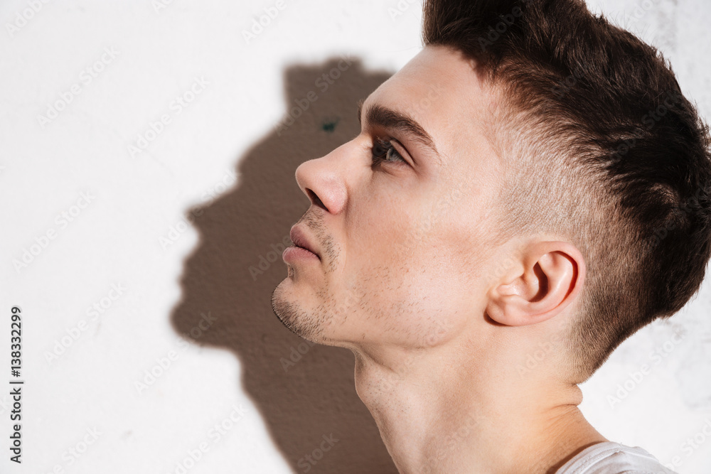 Handsome man standing on floor posing Stock Photo | Adobe Stock