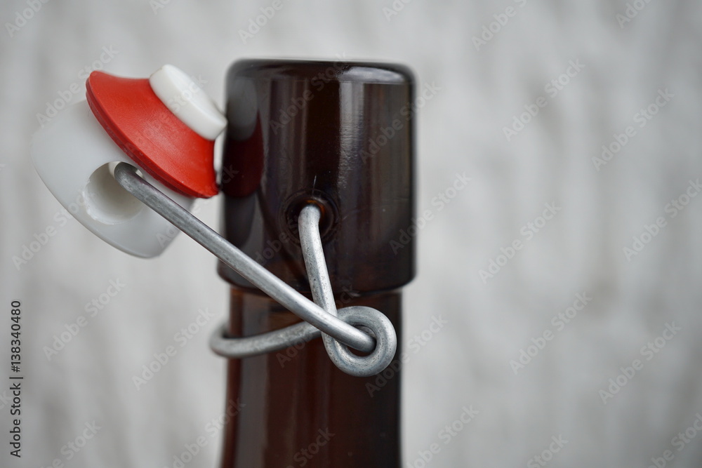 Detail view of beer bottle cap in retro design made of metal, ceramic ...