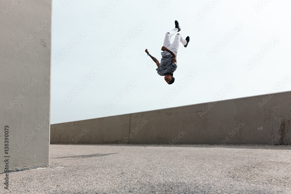 Man upside down in mid air doing backflip Stock Photo | Adobe Stock