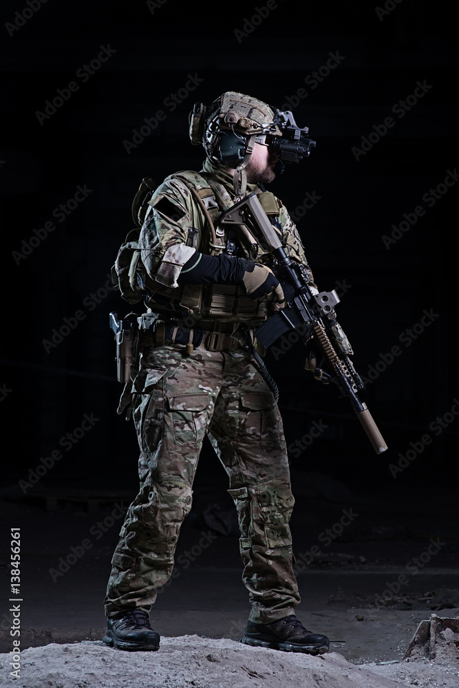 SWAT officer with night vision device and rifle/SWAT officer with a ...