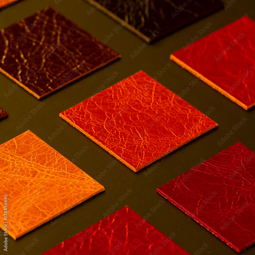 Colorful leather samples, choice of texture and color, dark background ...