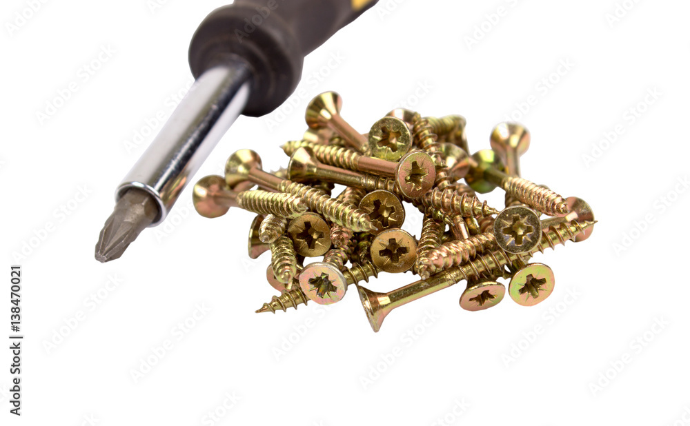 screws golden and screwdriver on a white background, for mounting tools ...
