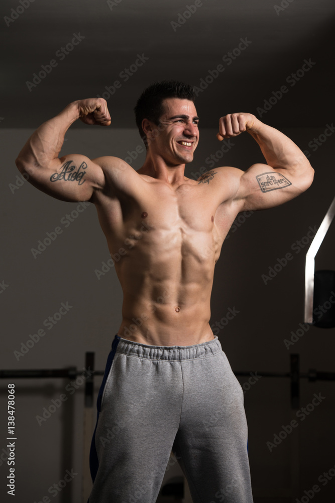 Bodybuilder Fitness Model Posing Double Biceps After Exercises Stock ...