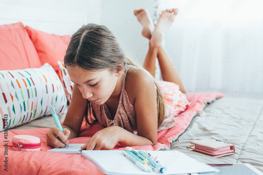 Pre teen girl writing diary Stock Photo | Adobe Stock Pre teen girl writing diary Stock Photo | Adobe Stock