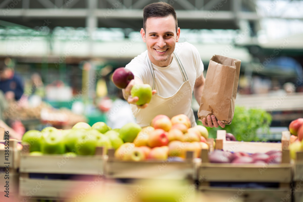 professional salesman offers at street market.. Stock Photo | Adobe Stock