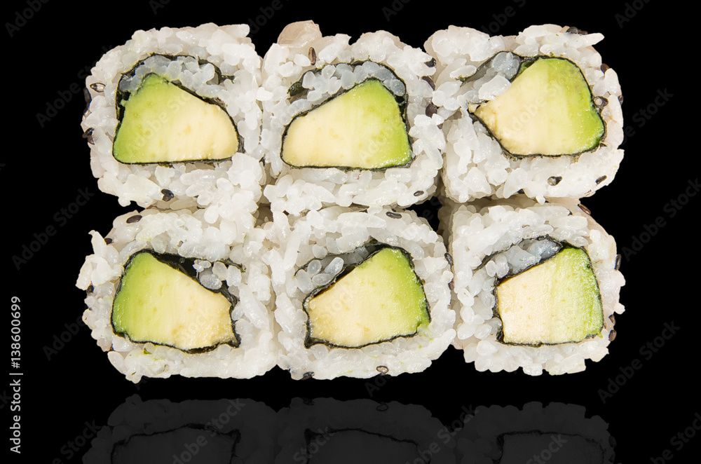 Six Japanese avocado hosomaki isolated on black background with ...