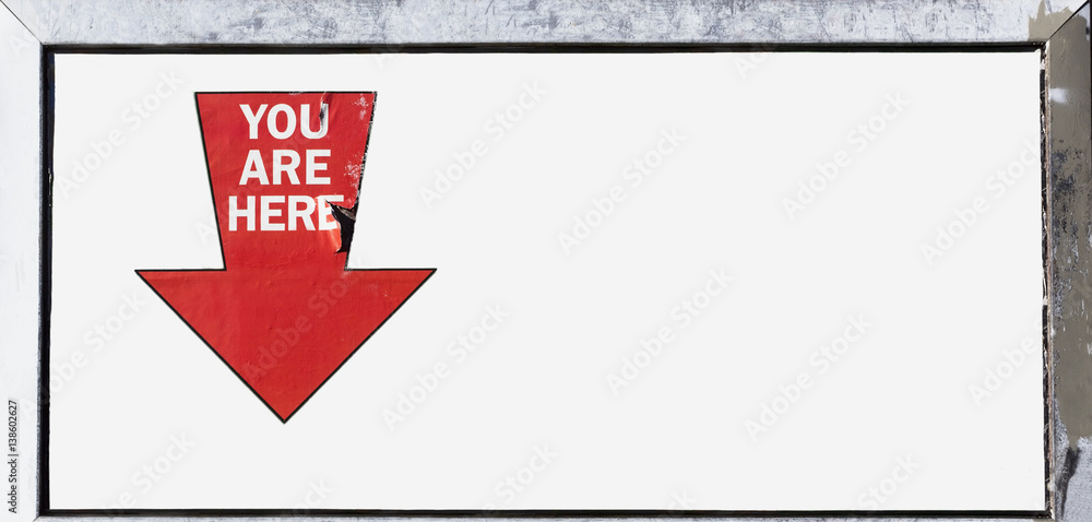 YOU ARE HERE SIGN with worn red arrow attached to wall. Lots of copy ...