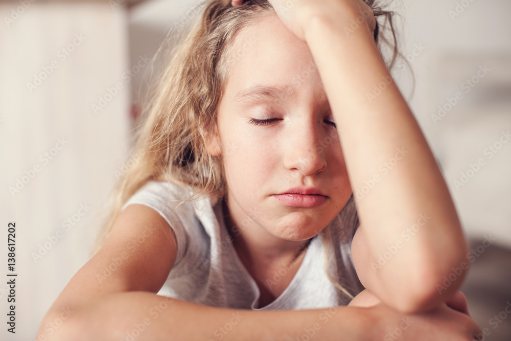 Sad child at home Stock Photo | Adobe Stock