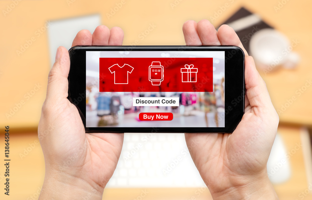 Watching two hand holding mobile phone with online shopping store and ...