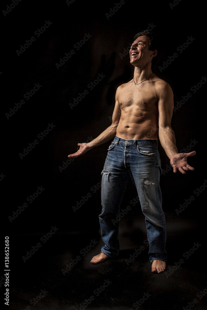 Isolated shirtless caucasian man with jeans standing smiling with open ...
