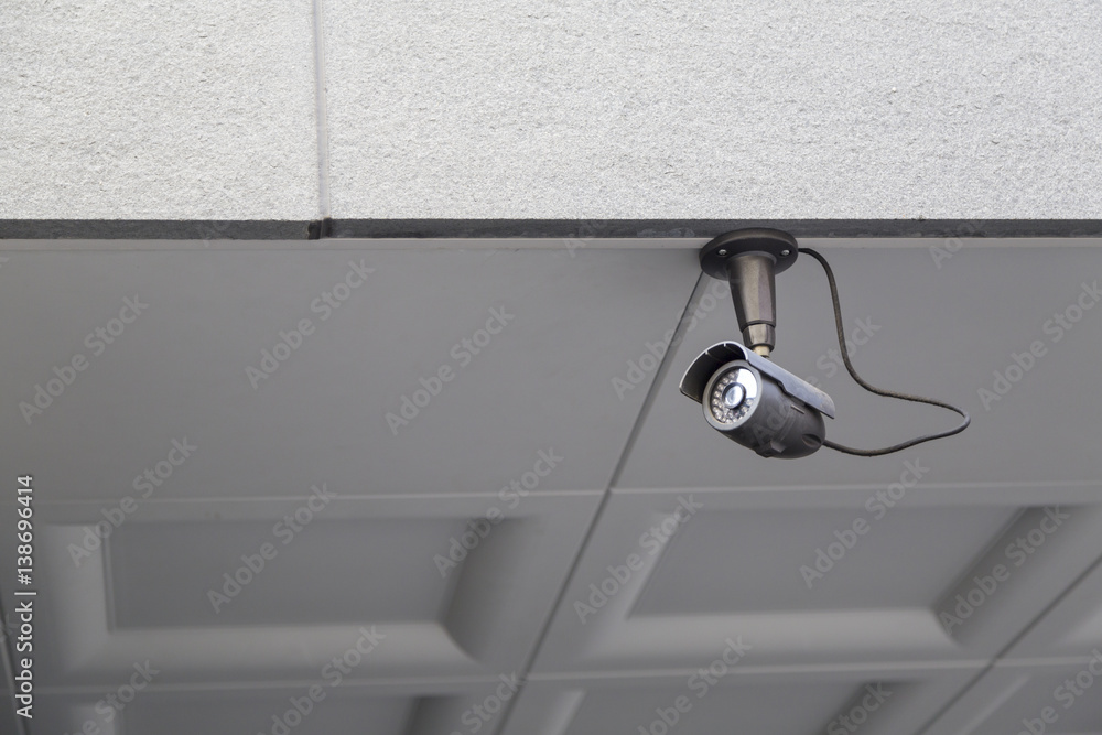 CCTV camera or surveillance installed on wall. Stock Photo | Adobe Stock