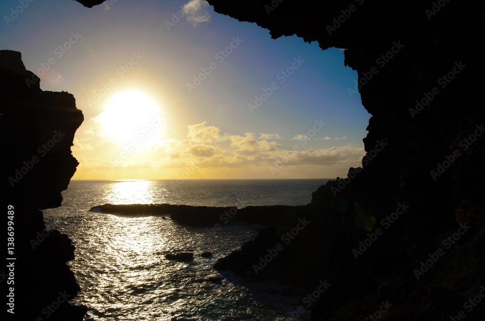 View onto the ocean during sunset through one of the windows at the Ana ...