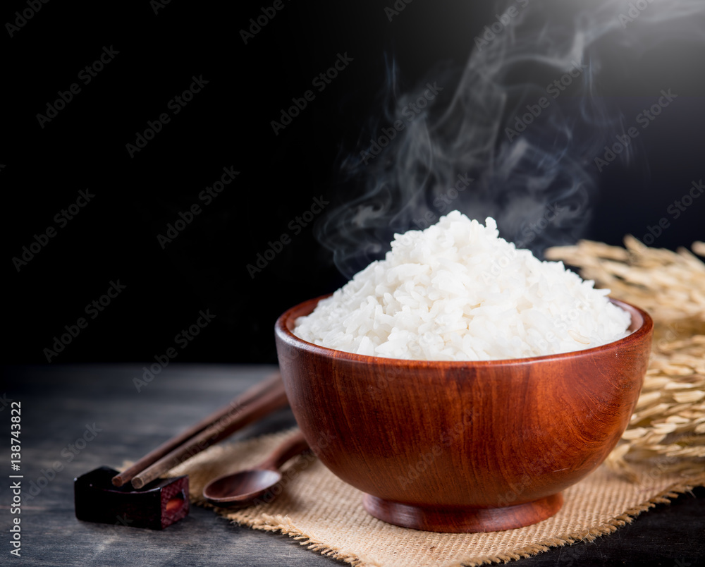 Cooked rice with smoke in wooden bowl,dark background Stock Photo ...