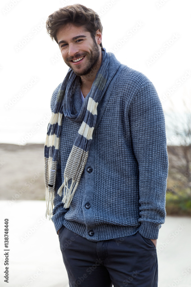 Handsome young man posing in a cold winter on the beach. Stock Photo ...