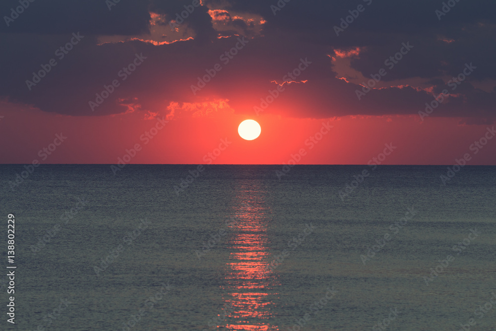 Sunset / sunrise over ocean / sea horizon with clouds. Stock Photo ...