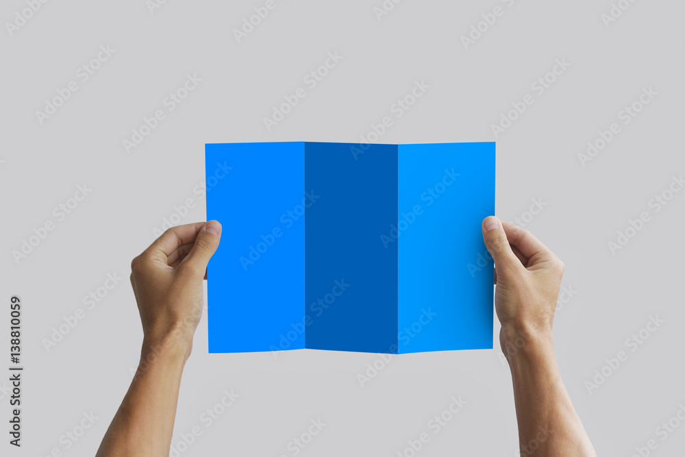 Hand holding blank brochure booklet in the hand. Leaflet presentation ...
