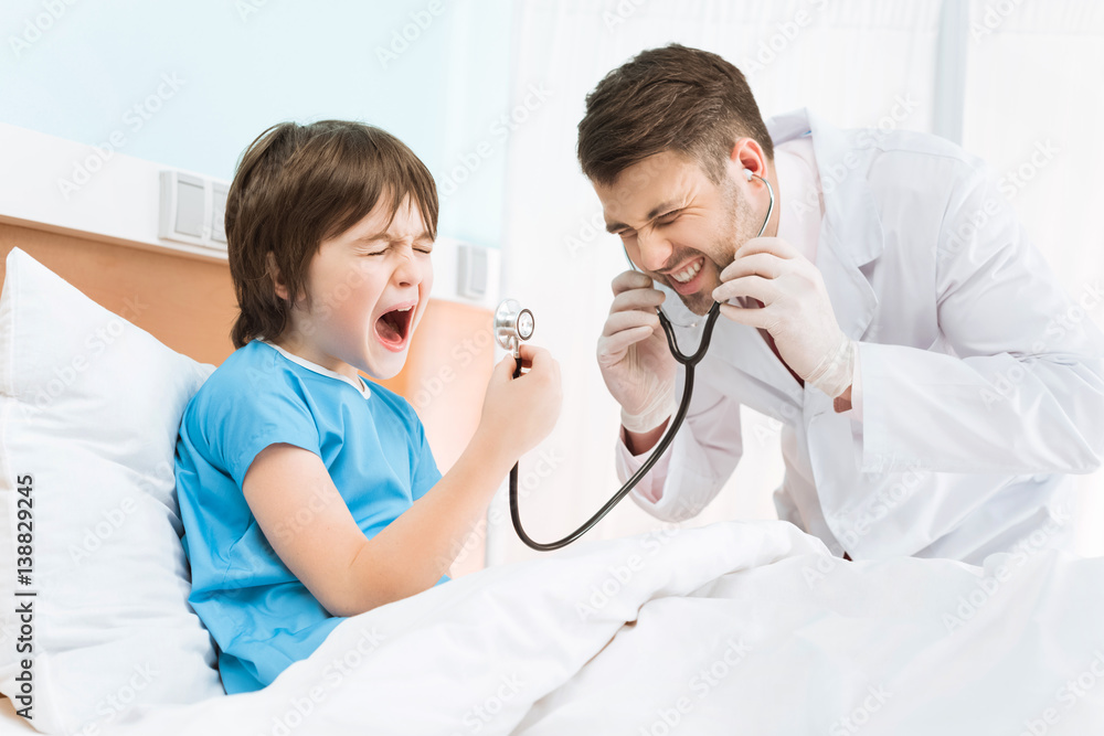 little boy screaming into doctor's stethoscope in hospital Stock Photo ...