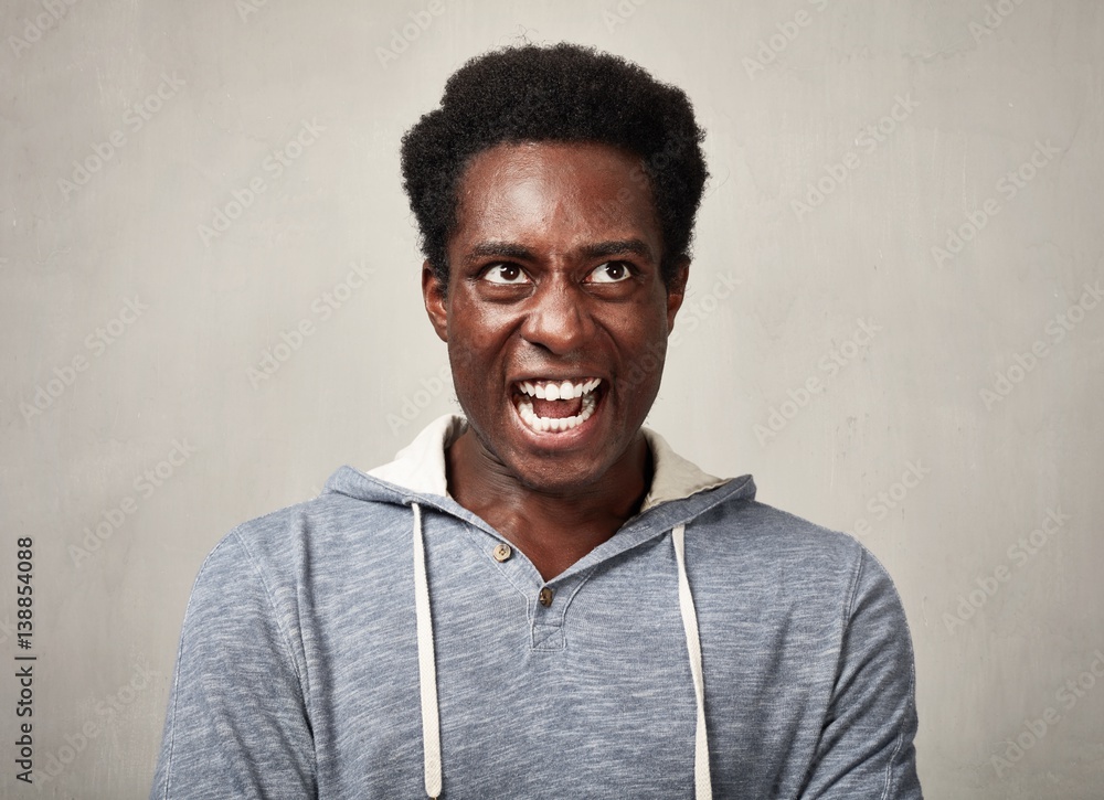 Angry black man. Stock Photo | Adobe Stock