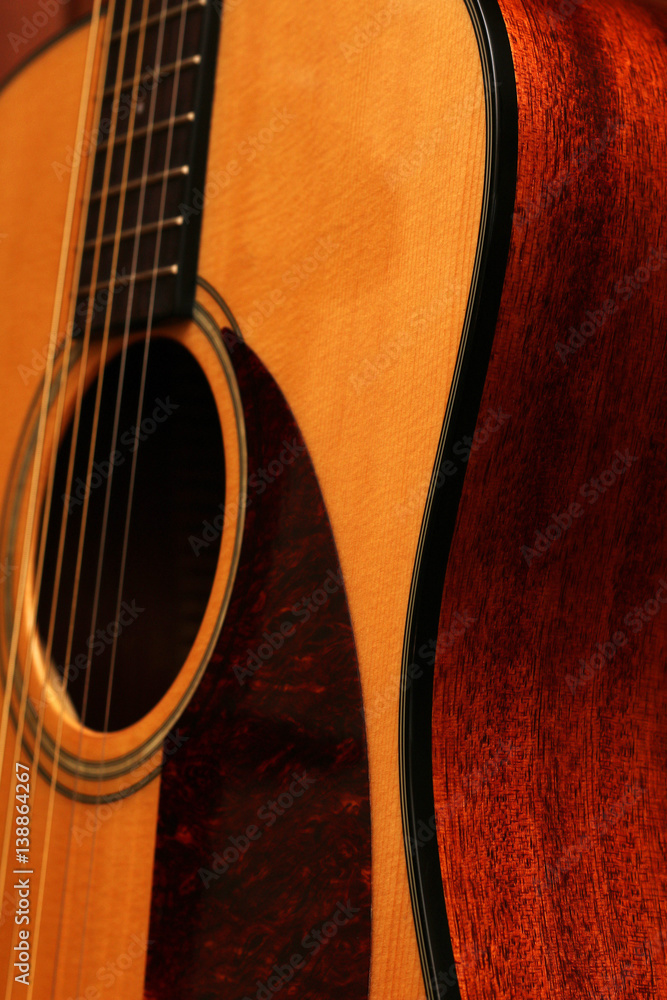 Shapes and curves of an acoustic guitar body. Stock Photo | Adobe Stock