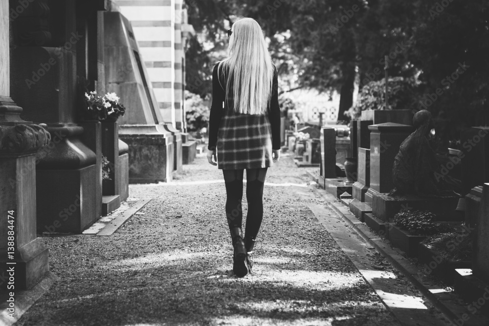 Blond girl alone at cemetery, Cimitero Monumentale, Milan, Italy Stock ...