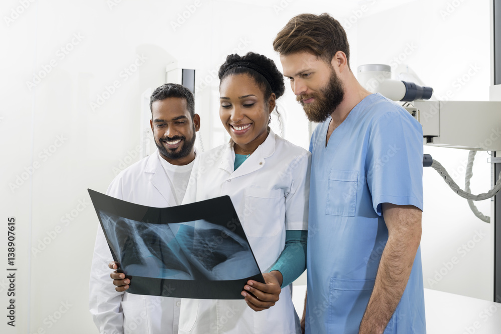 Radiologists Examining Chest X-ray In Examination Room Stock Photo ...