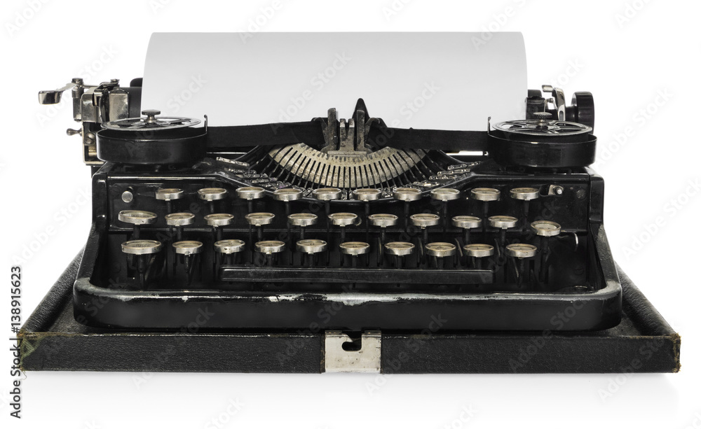 Old antique vintage portable typewriter, with a blank sheet of paper ...