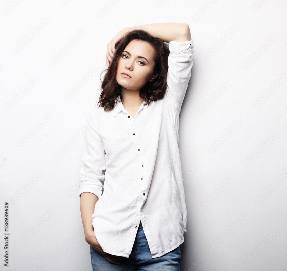 young woman wearing casual clothes, posing on white background Stock ...