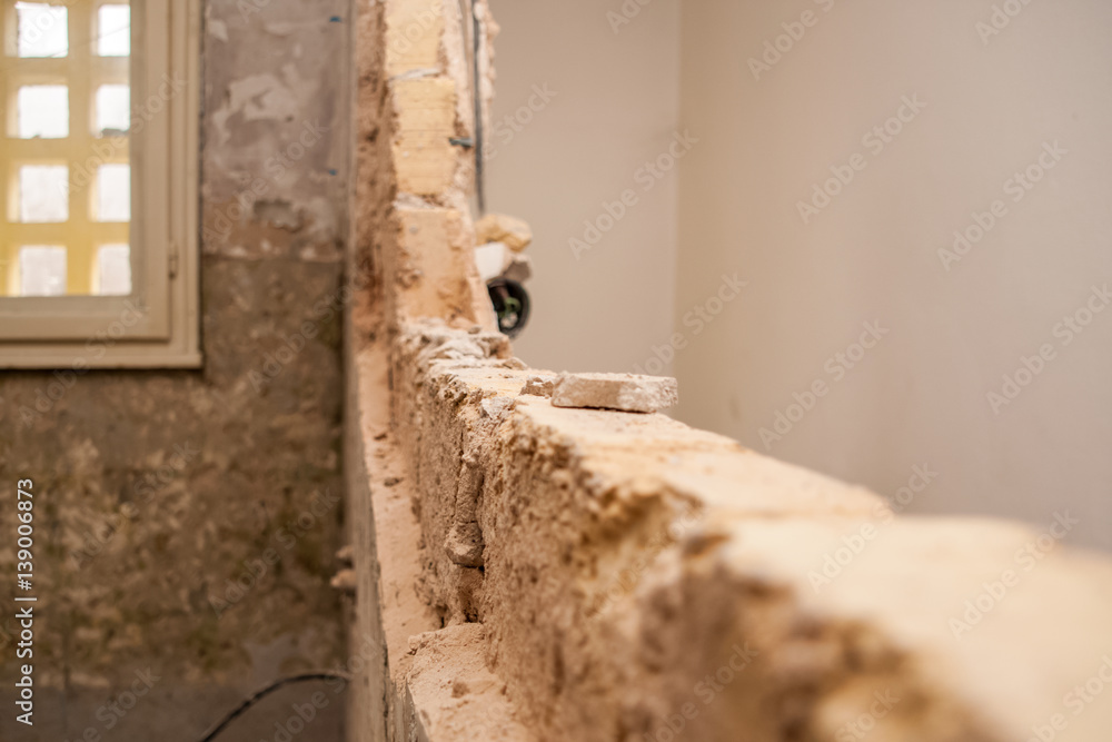 Flat renovation, demolition of the partition wall to create a single ...