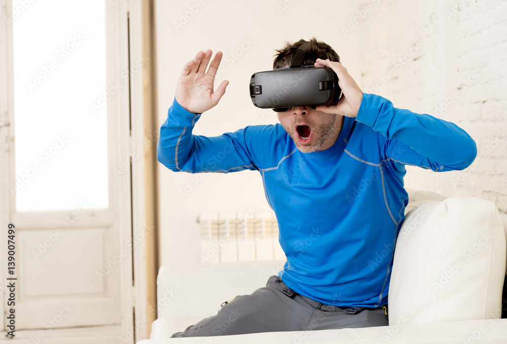 happy man at home living room sofa couch excited using 3d goggles ...
