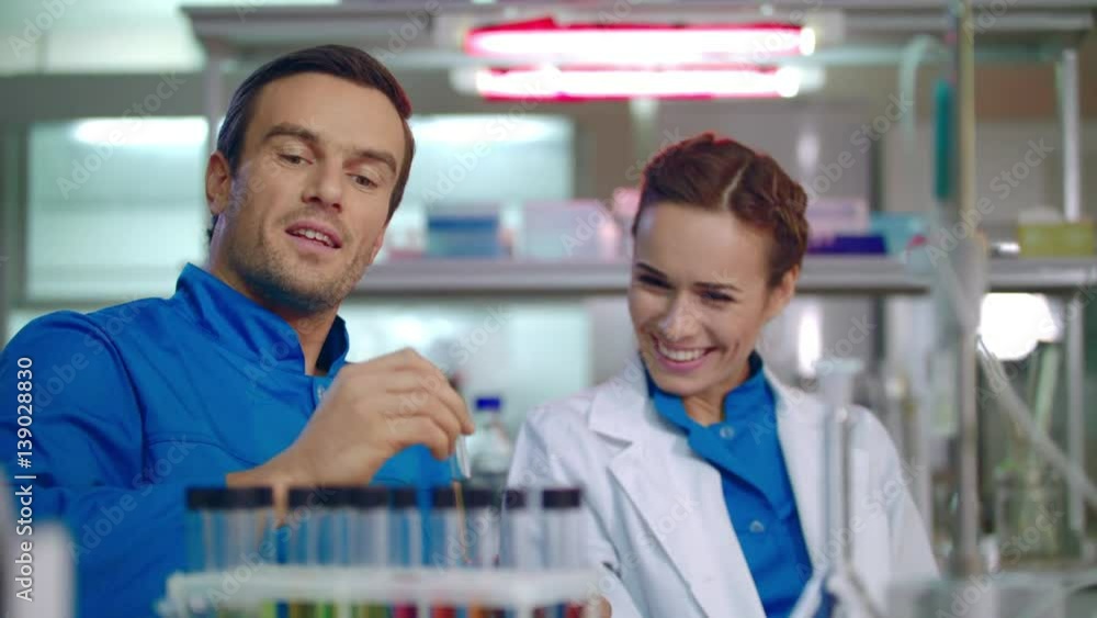 Group of doctors in clinical lab. Female and male doctor laughing in ...