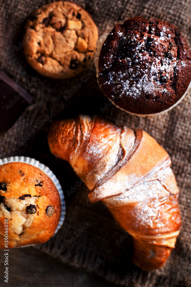 Delicious Chocolate muffins, croissants and dark chocolate pieces on ...