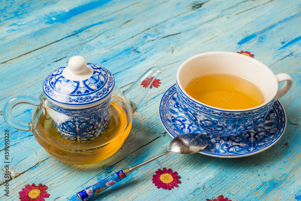Transparent teapot and cup of tea Stock Photo | Adobe Stock