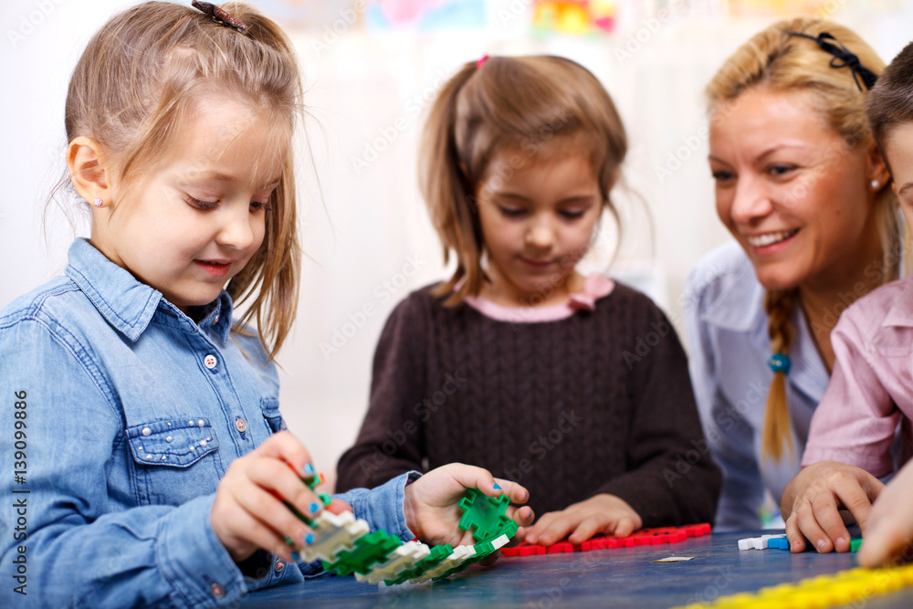 Playing with puzzles Stock Photo | Adobe Stock
