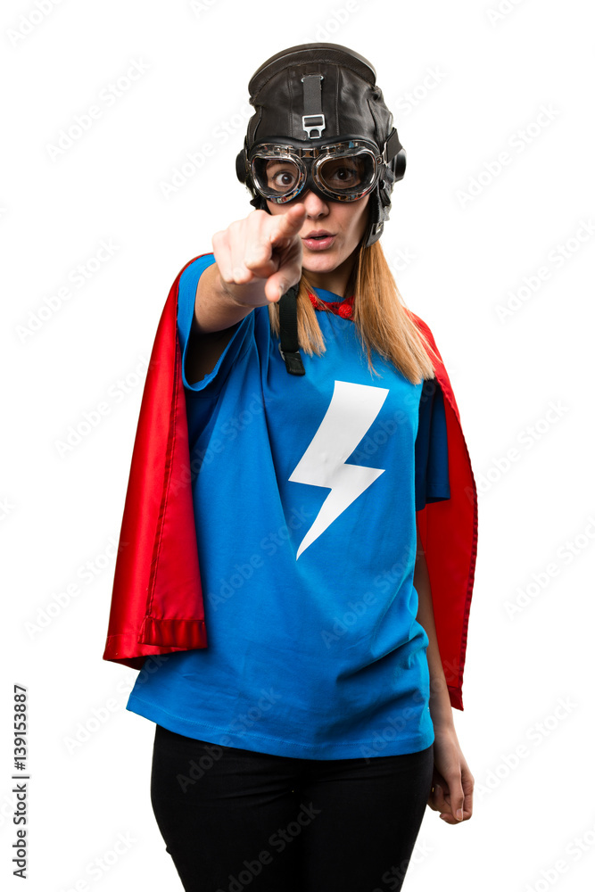 Pretty superhero girl pointing to the front Stock Photo | Adobe Stock