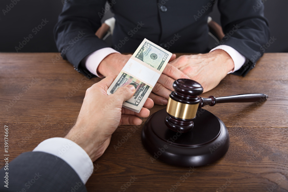 Businessman Giving A Bribe To A Judge Stock-Foto | Adobe Stock