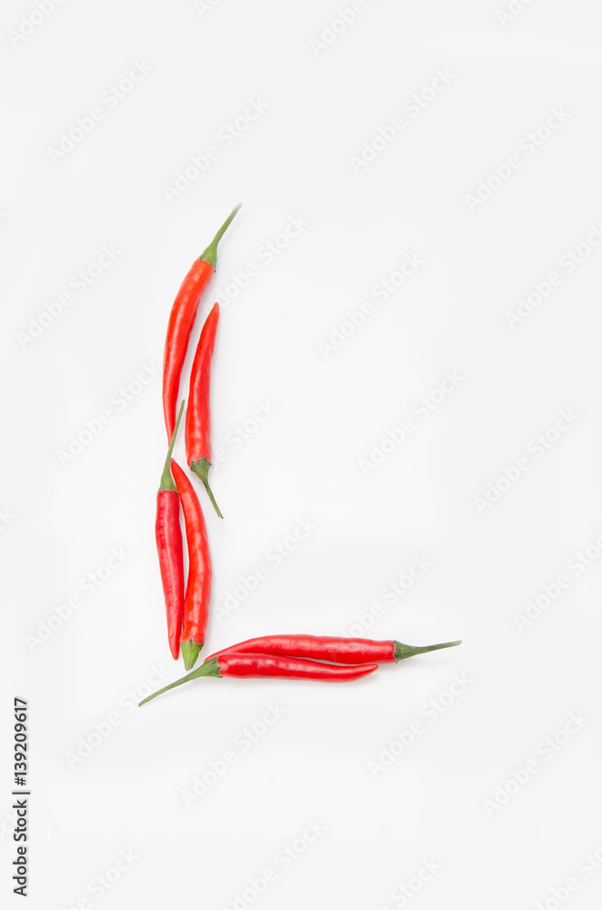 Bold letter L Latin alphabet of red hot chili pepper on a white ...