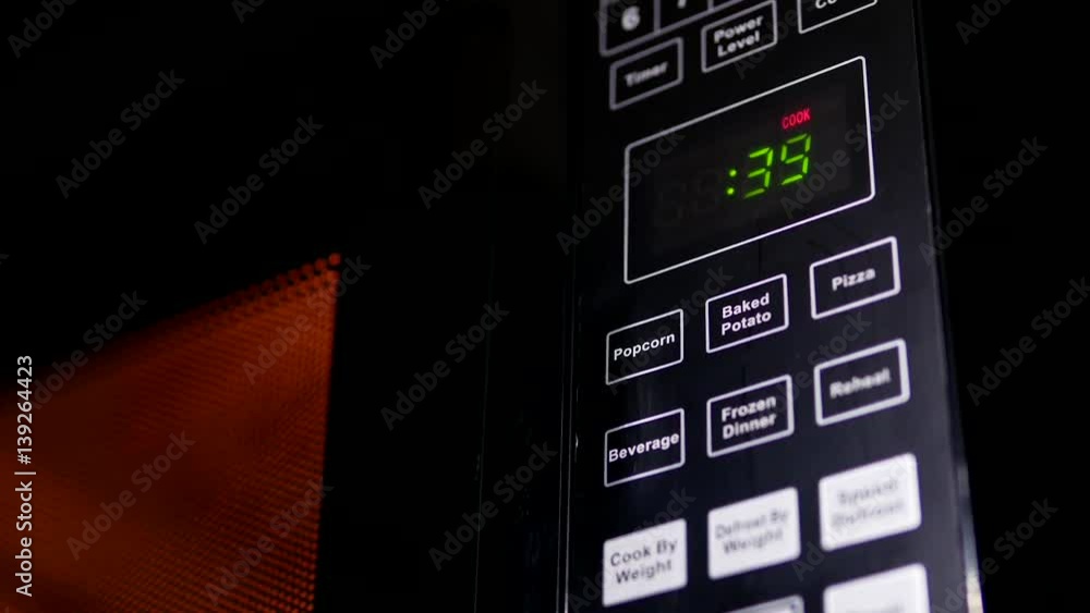 Motion of food being heated in microwave oven Stock Video | Adobe Stock