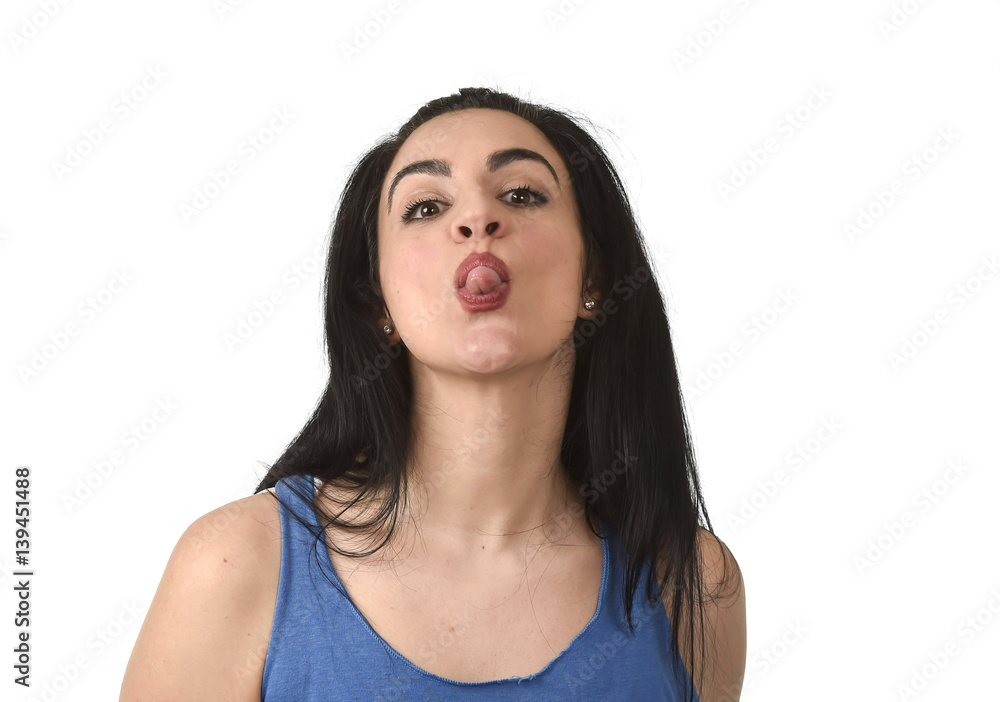 attractive and playful woman sticking out tongue in funny fresh face ...