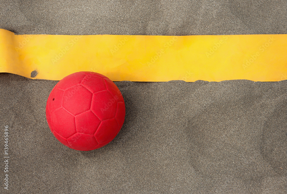 Handball ball on the beach in the sand Stock Photo | Adobe Stock