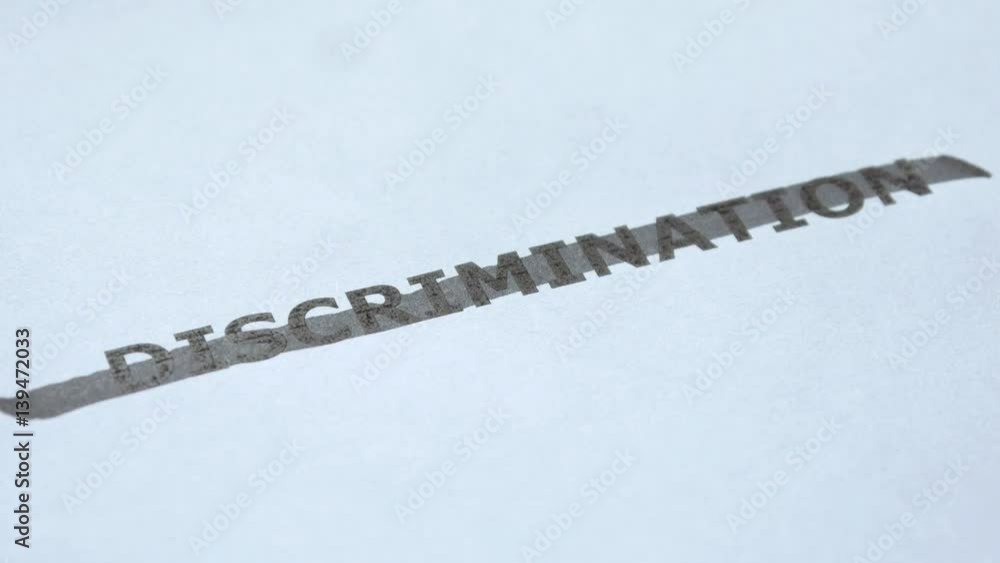 Man hand crosses out the word Discrimination with black marker. Stop ...