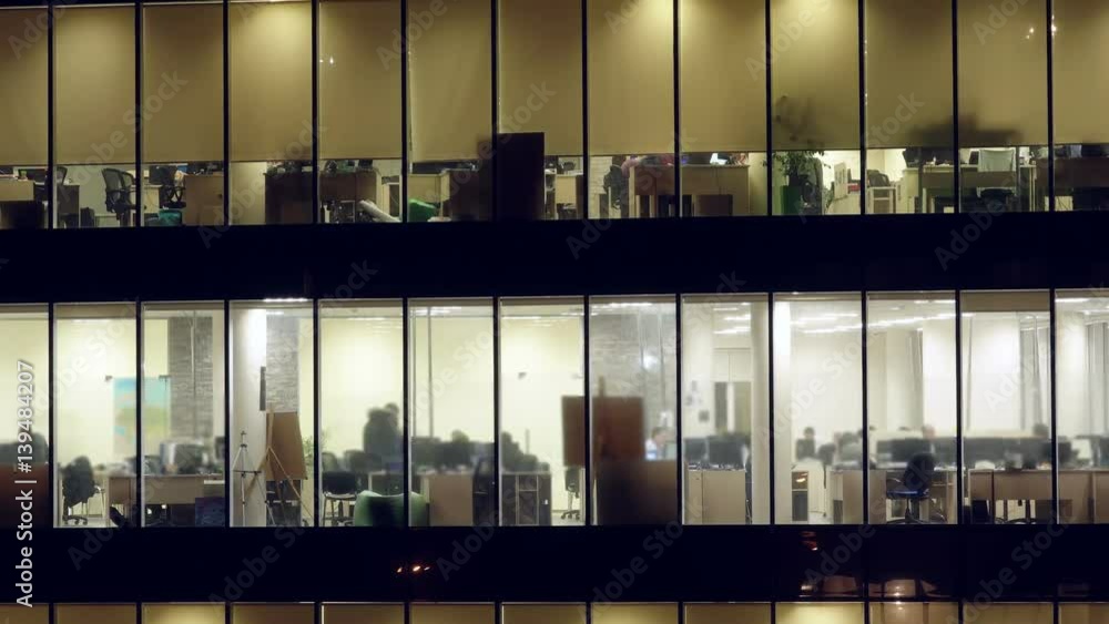 Modern glass office building with people working inside. Business ...