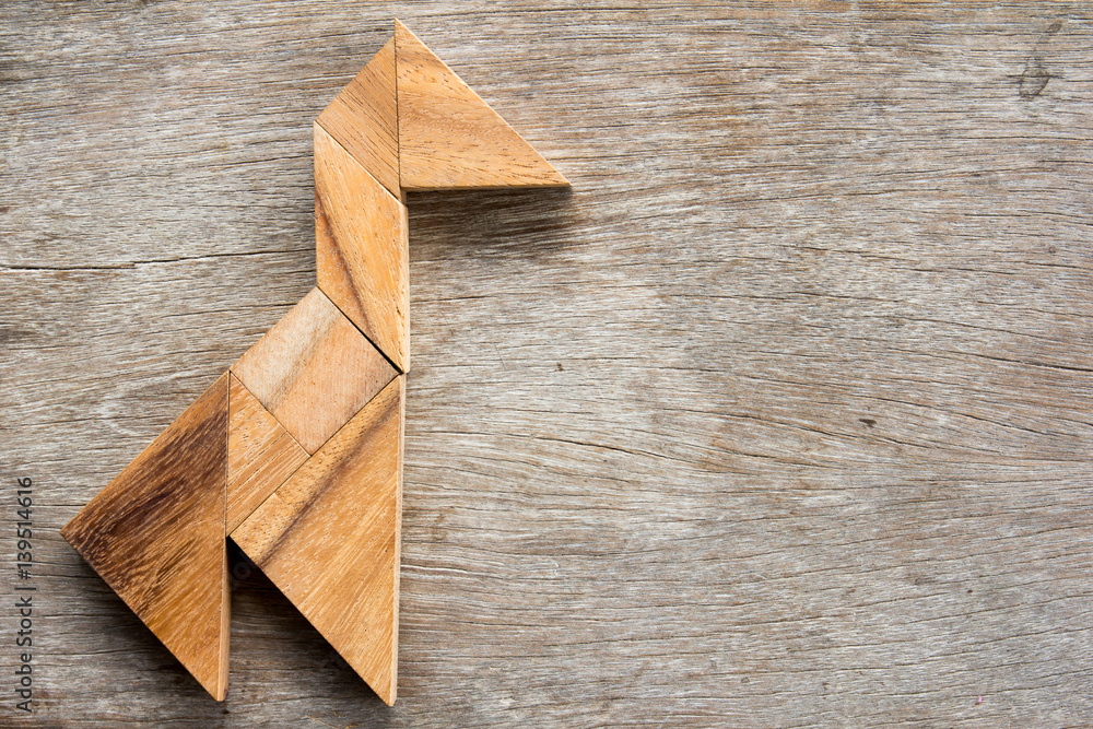 Wooden tangram puzzle in giraffe shape with copy space background Stock ...