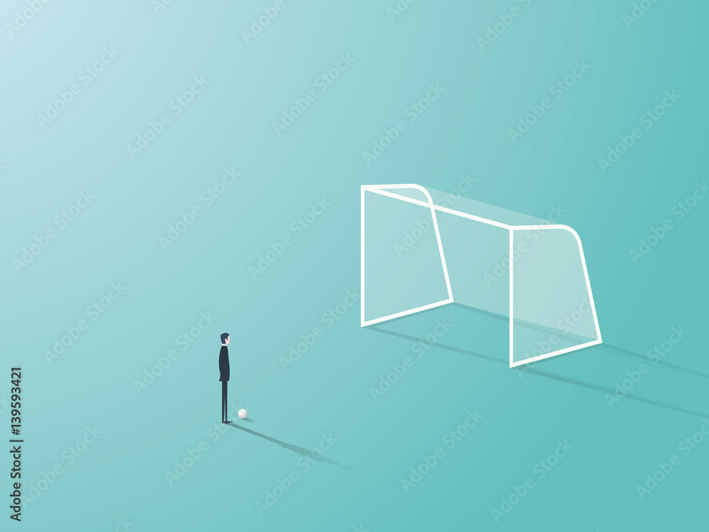 Businessman standing in front of soccer or football goal empty net with ...